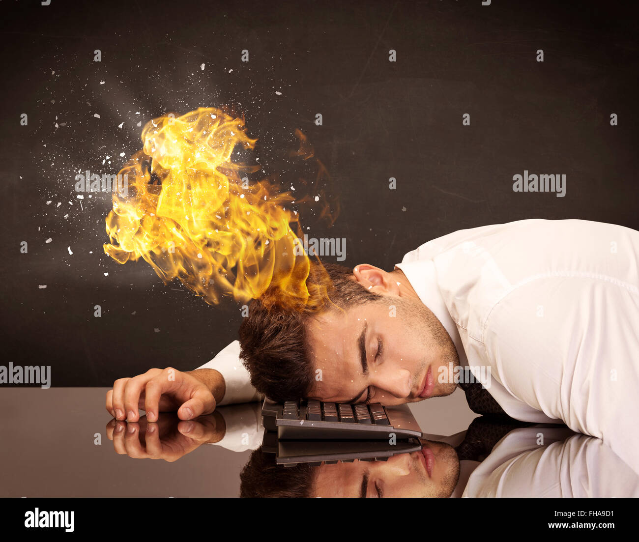Stressed business man's head is burning Stock Photo - Alamy