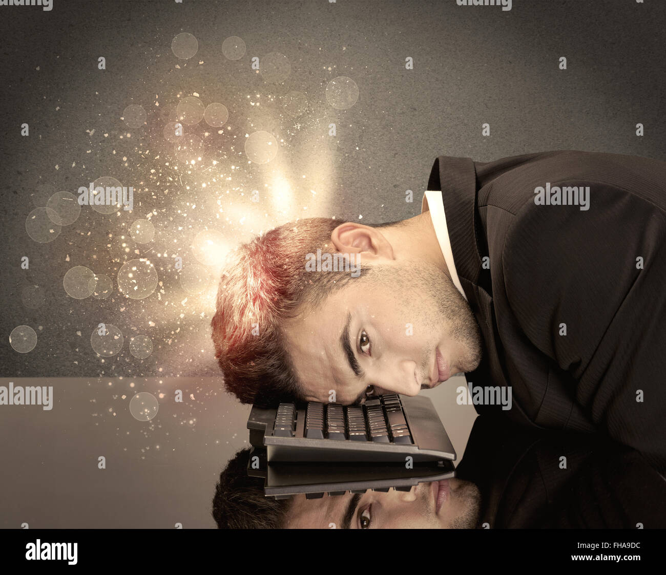 Angry businessman with lights and keyboard Stock Photo - Alamy