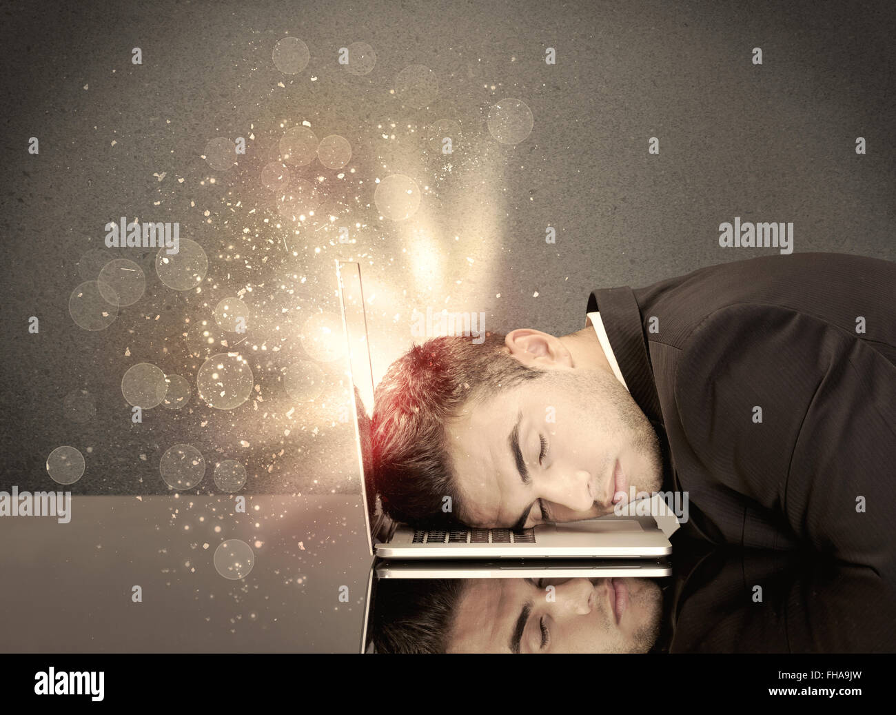 Angry businessman with lights and keyboard Stock Photo - Alamy