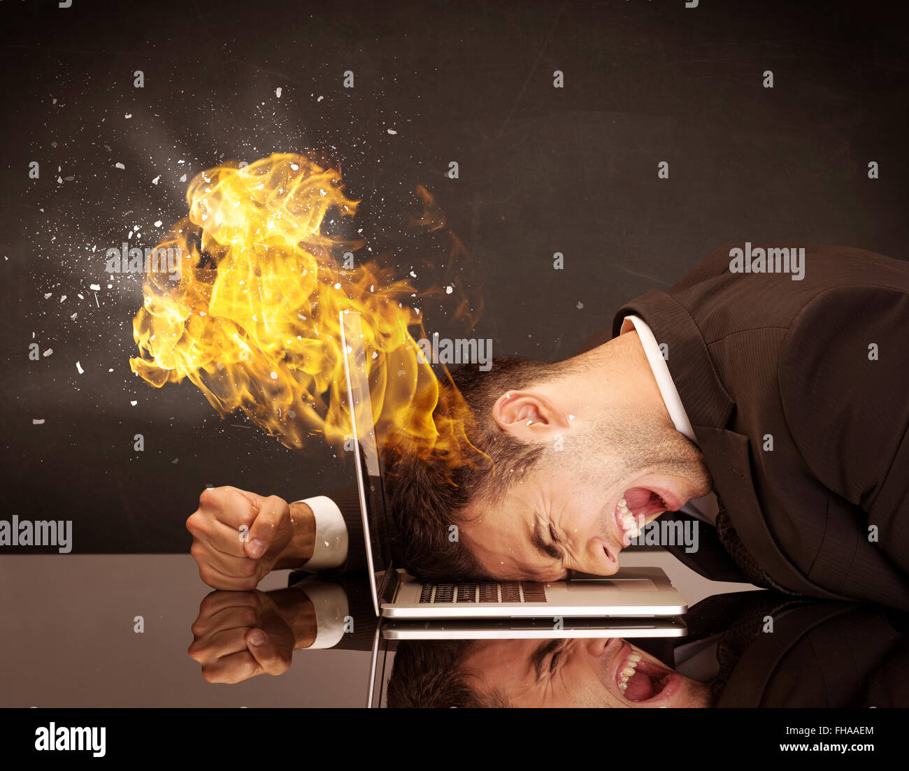 Stressed business man's head is burning Stock Photo - Alamy