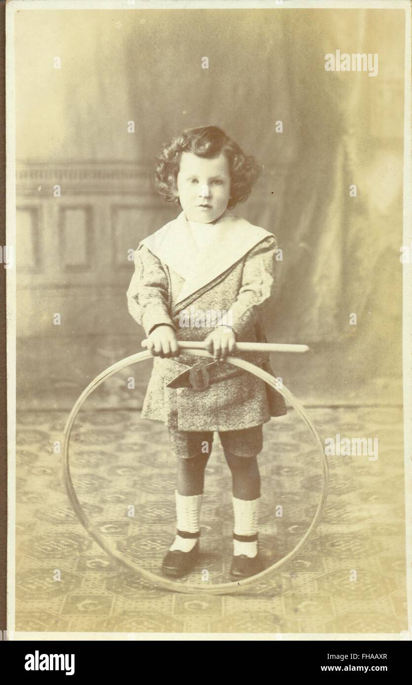 Portrait postcard of boy with wooden hoop Stock Photo - Alamy