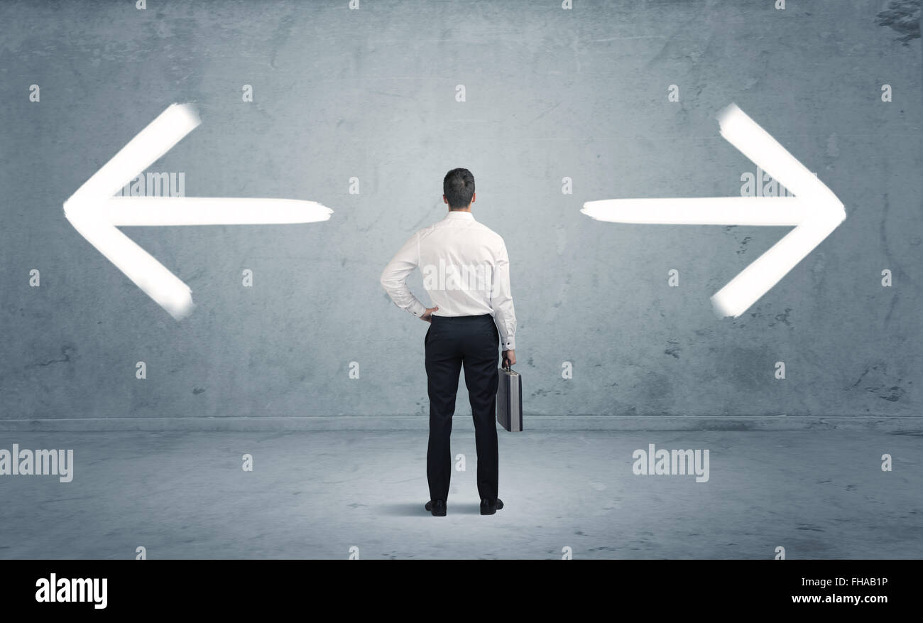 Confused business person choosing the way Stock Photo - Alamy