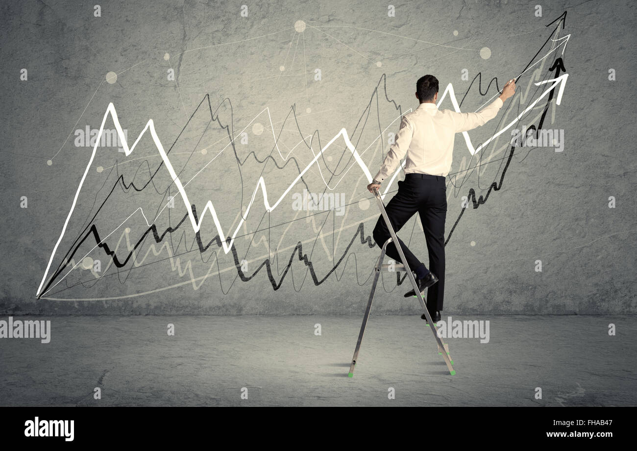 Man on ladder drawing lines Stock Photo - Alamy