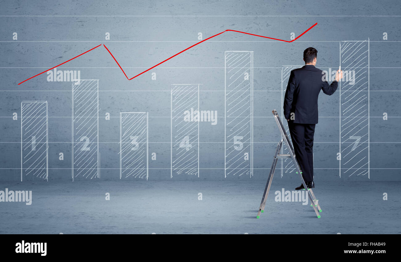 Man drawing chart from ladder Stock Photo - Alamy