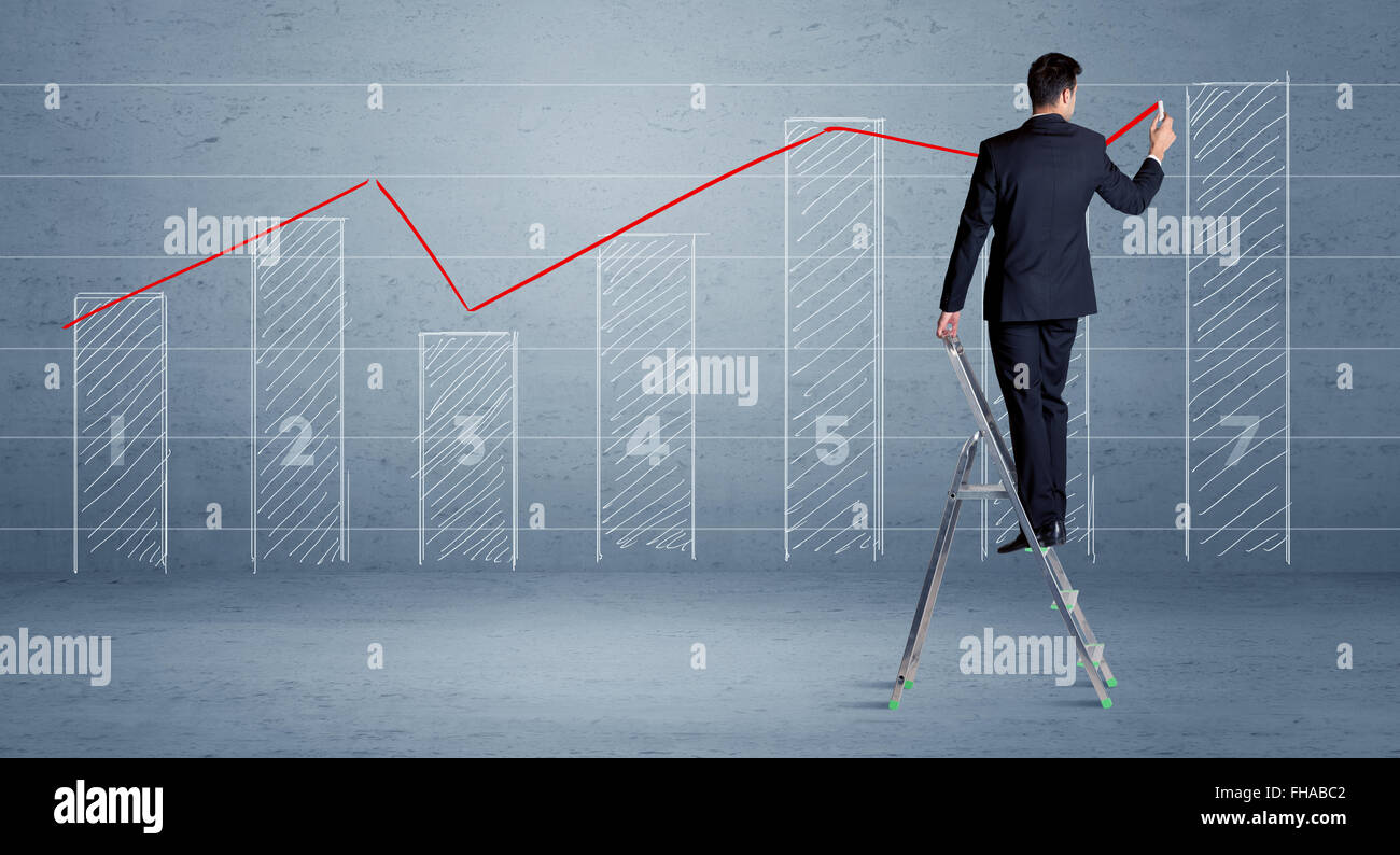 Man drawing chart from ladder Stock Photo - Alamy