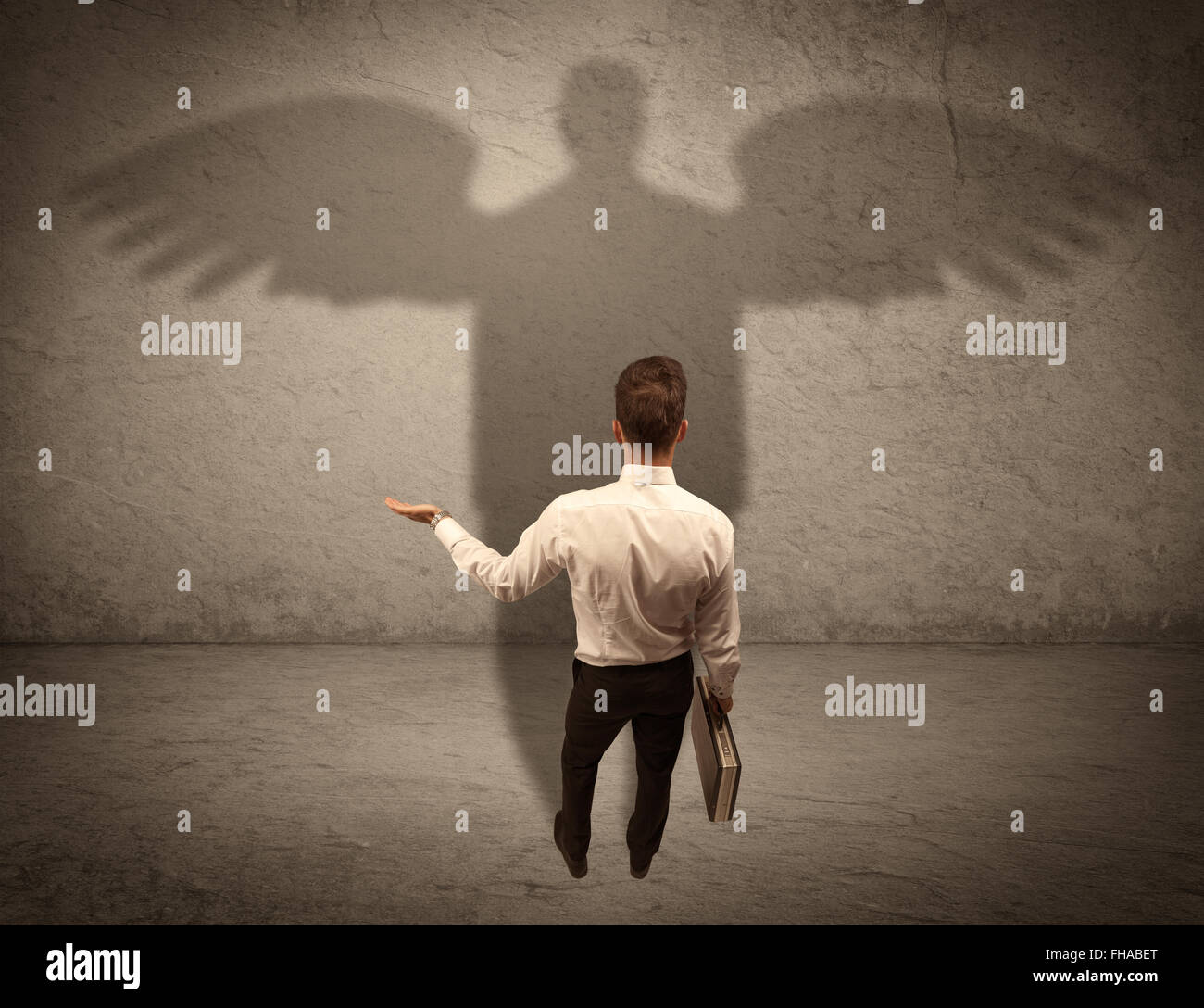 Business man angel shadow hi-res stock photography and images - Alamy
