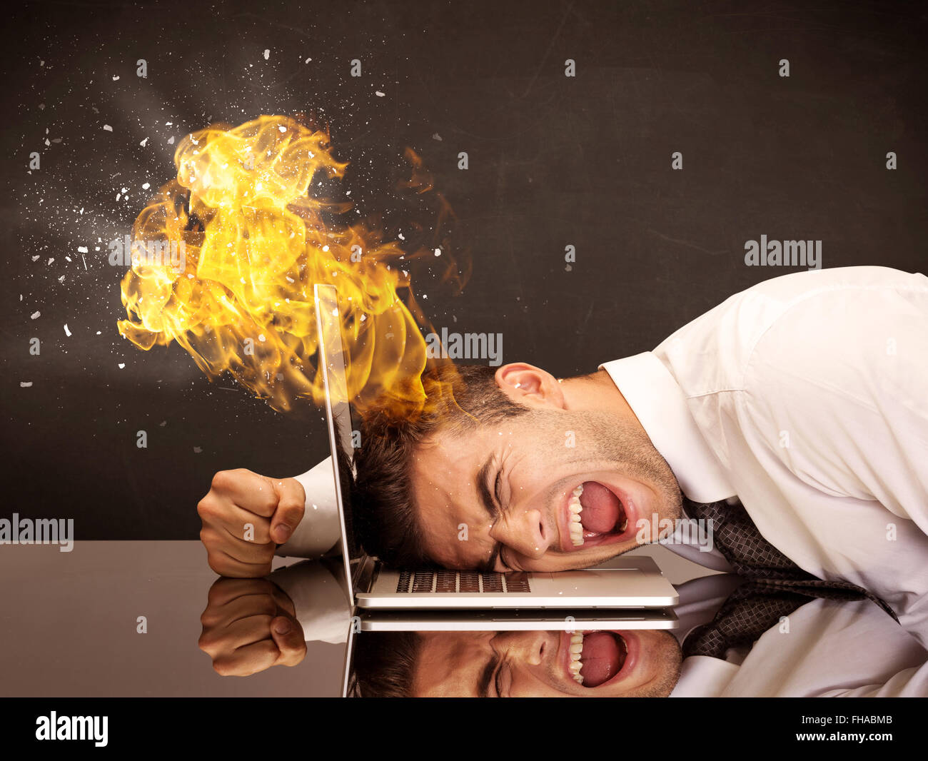 Stressed business man's head is burning Stock Photo - Alamy
