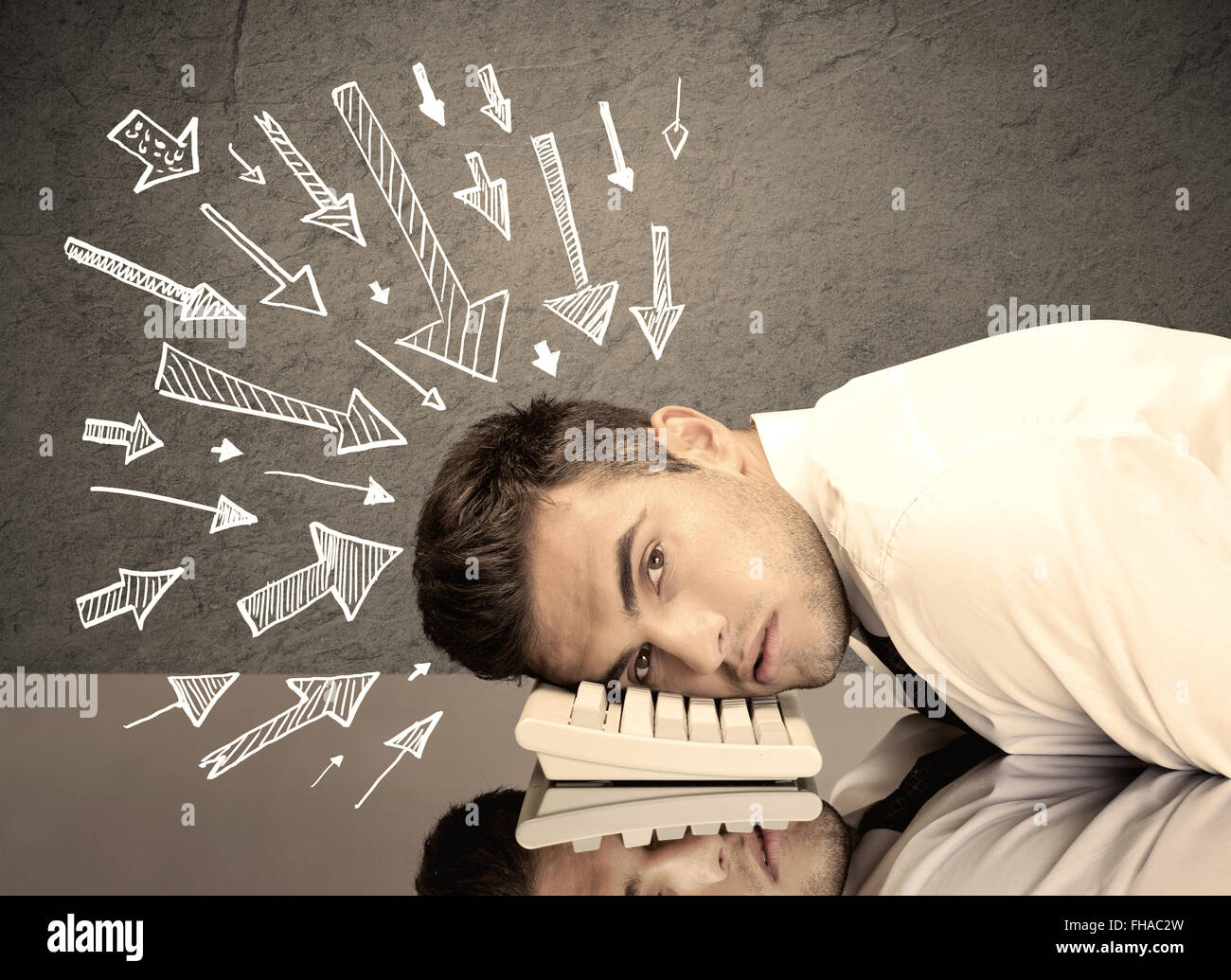 Arrows pointing at sad office worker Stock Photo - Alamy