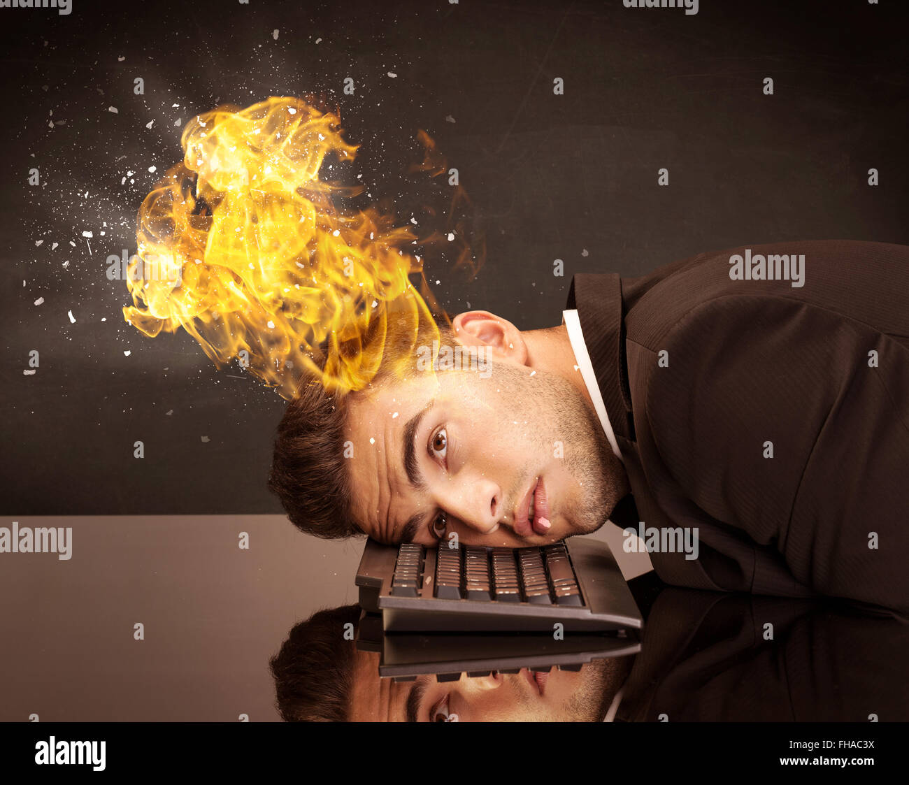 Stressed business man's head is burning Stock Photo - Alamy