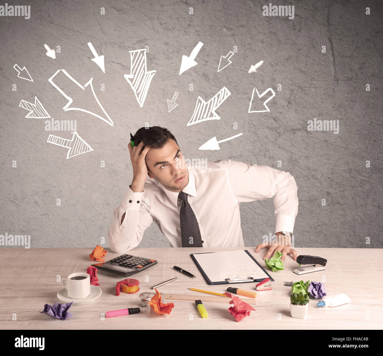 Busy office worker with drawn arrows Stock Photo - Alamy