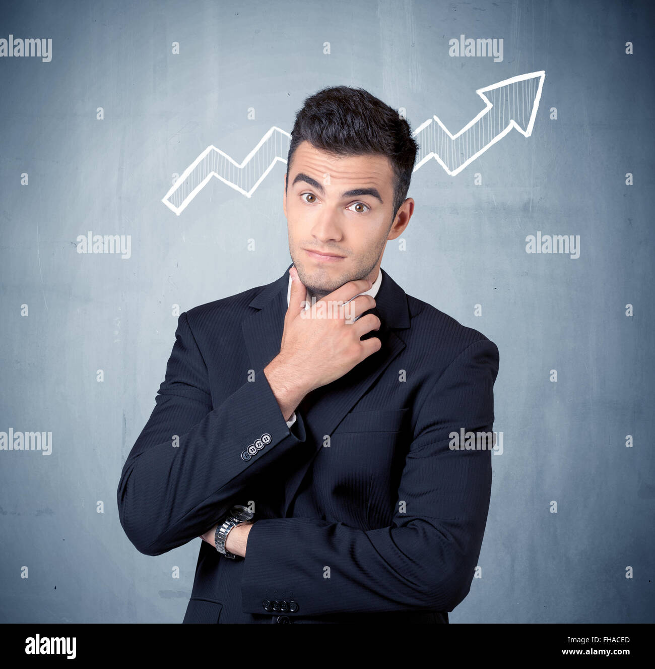 Smiling business guy with graph arrow Stock Photo - Alamy