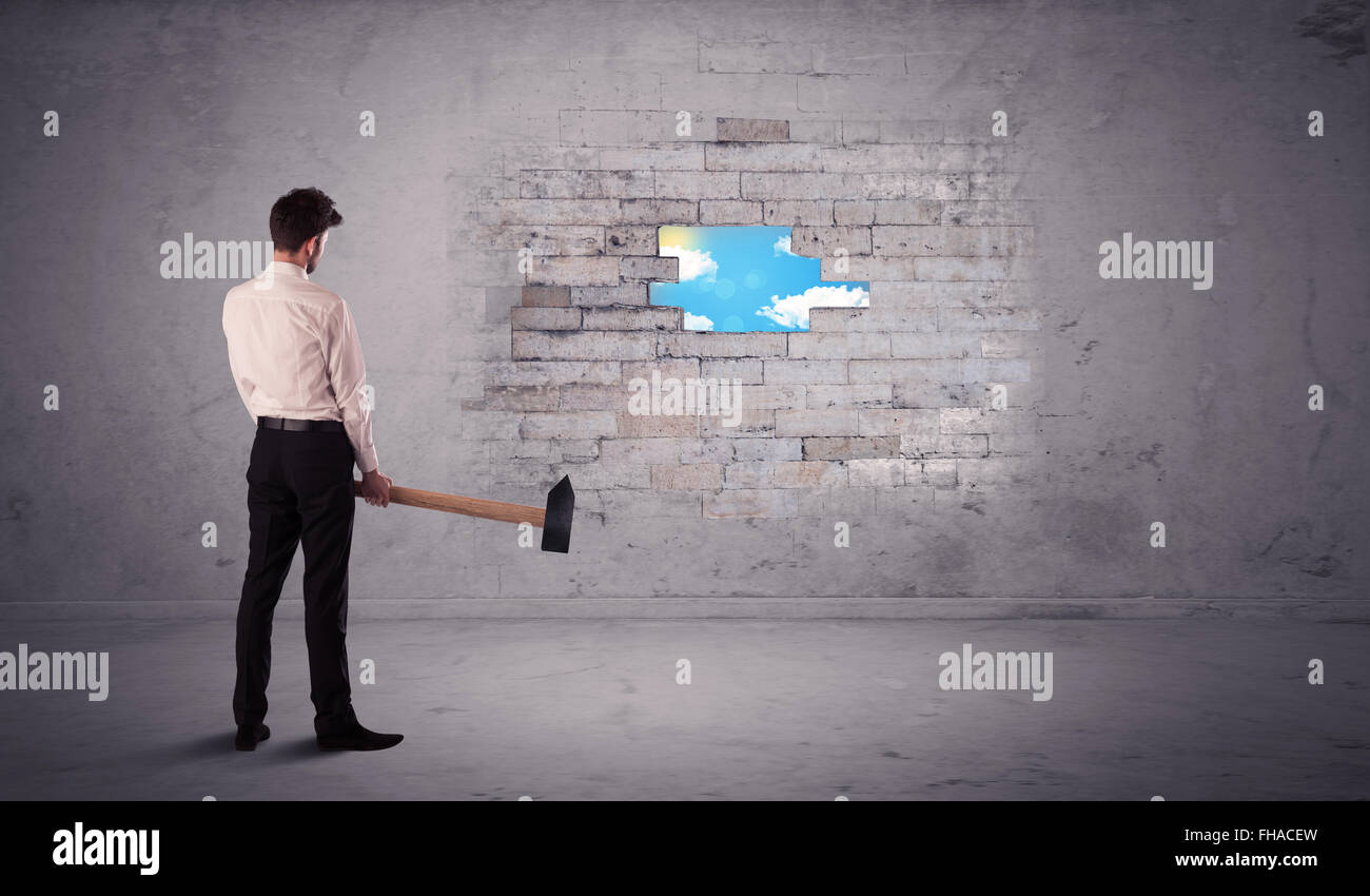 Business man hitting brick wall with hammer Stock Photo - Alamy