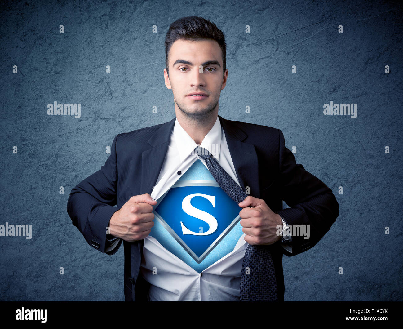Businessman ripping off his shirt with superhero sign Stock Photo - Alamy