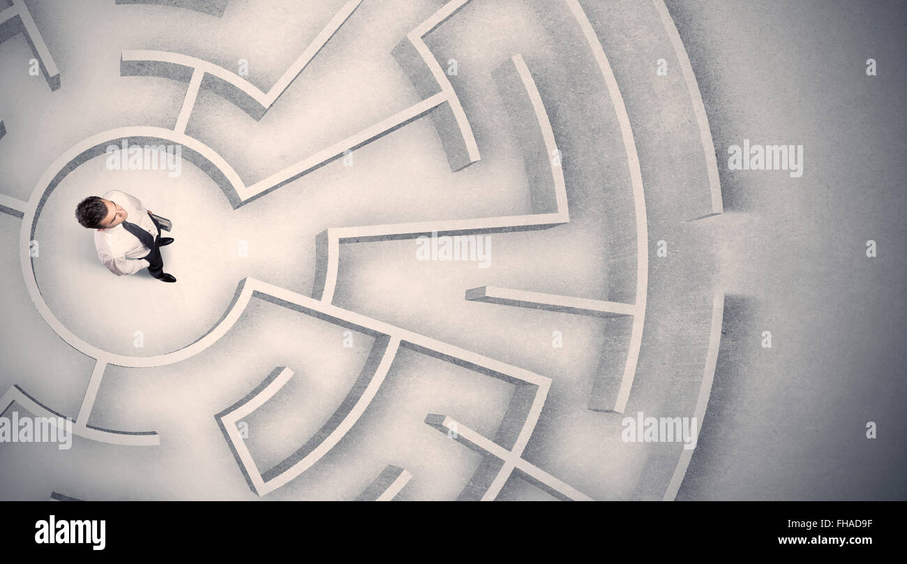 Business man trapped in a circular maze Stock Photo - Alamy