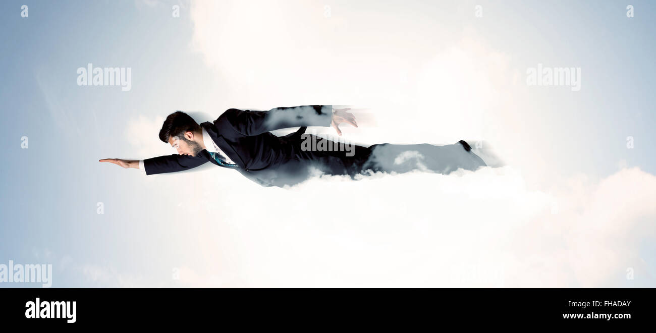 Business man flying like a superhero in clouds on the sky Stock Photo ...