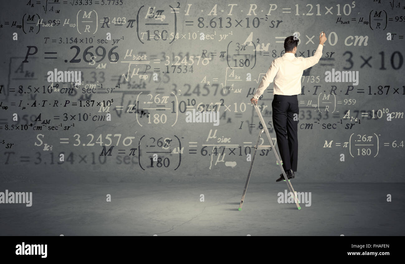 Man calculating from ladder Stock Photo - Alamy