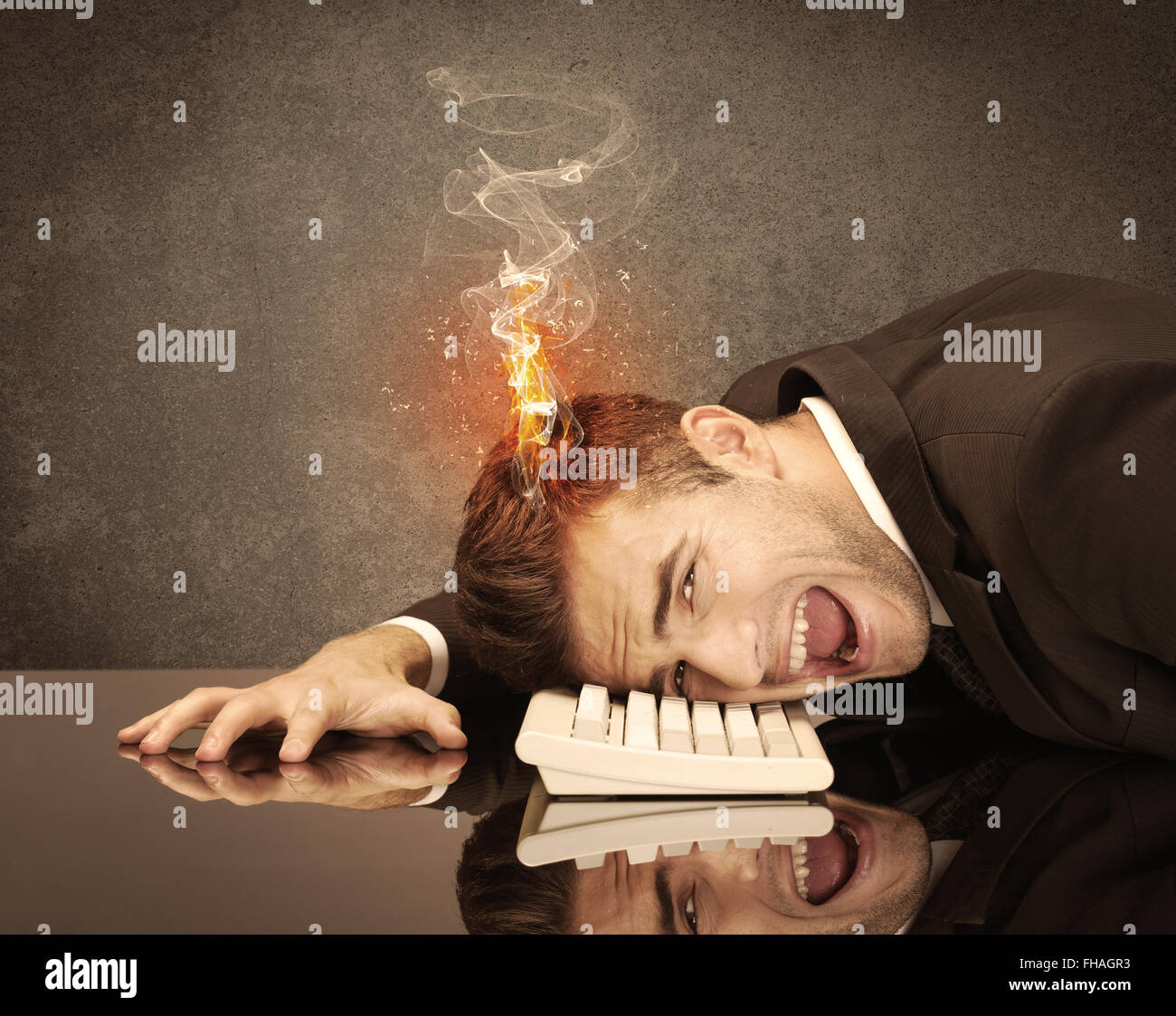 Sad business person's head catching fire Stock Photo - Alamy
