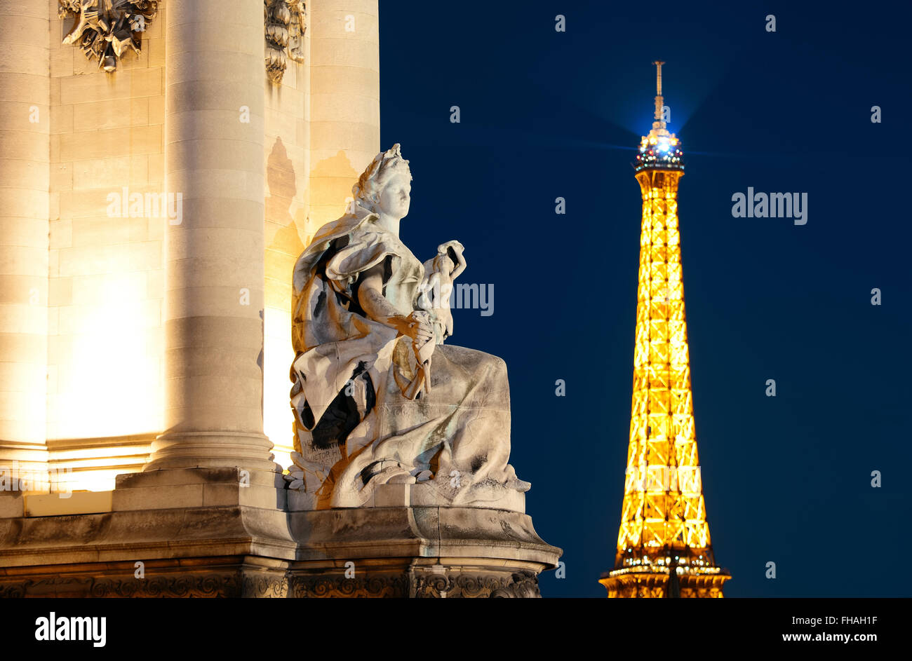 PARIS, FRANCE - MAY 13: Eiffel Tower and statue at night on May 13 ...