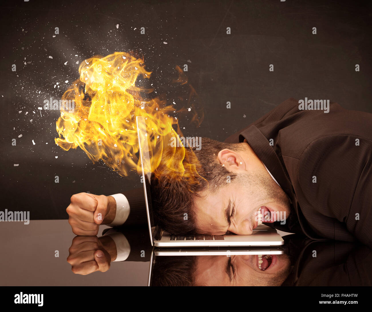 Stressed business man's head is burning Stock Photo - Alamy