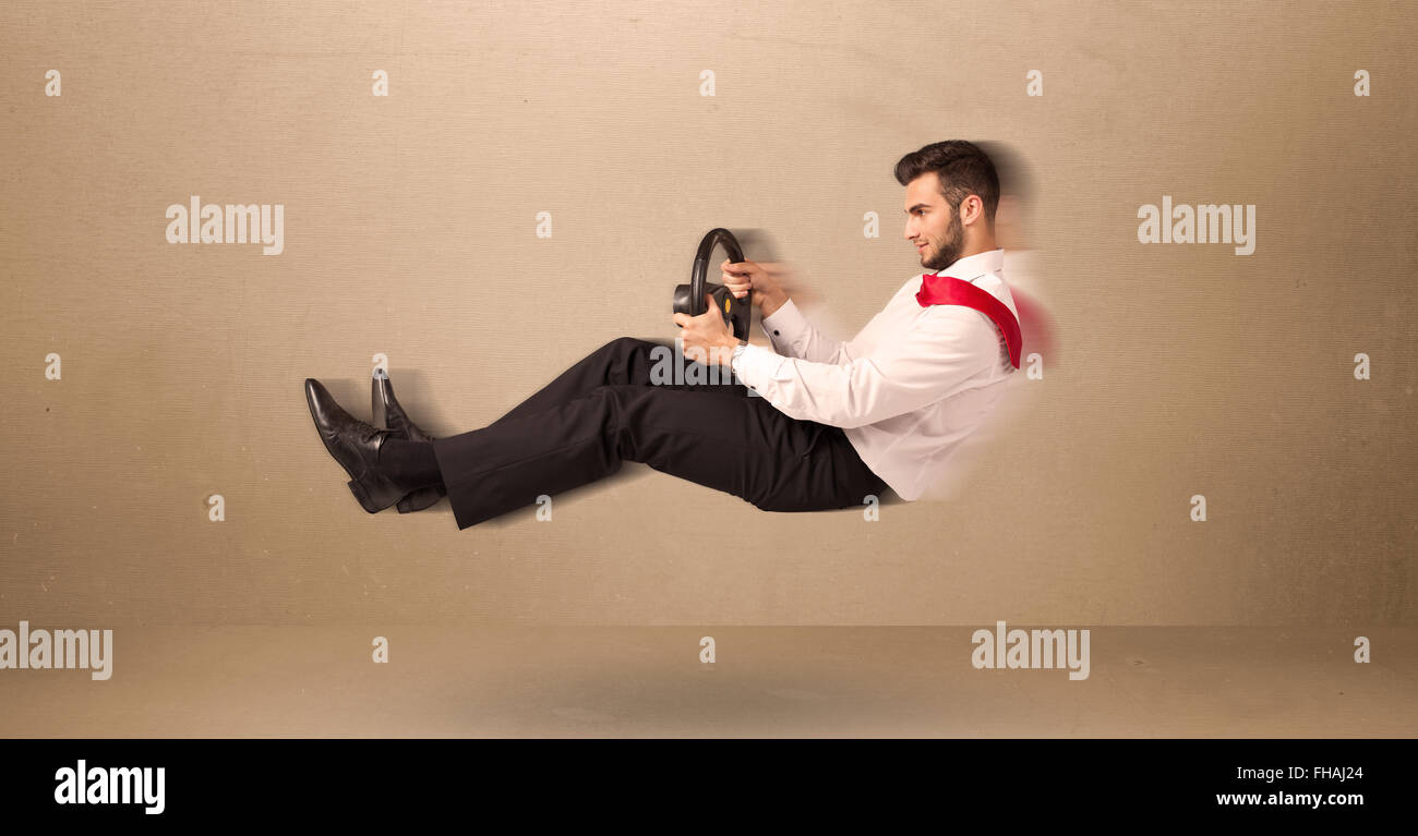 Happy funny man driving a flying car concept Stock Photo - Alamy