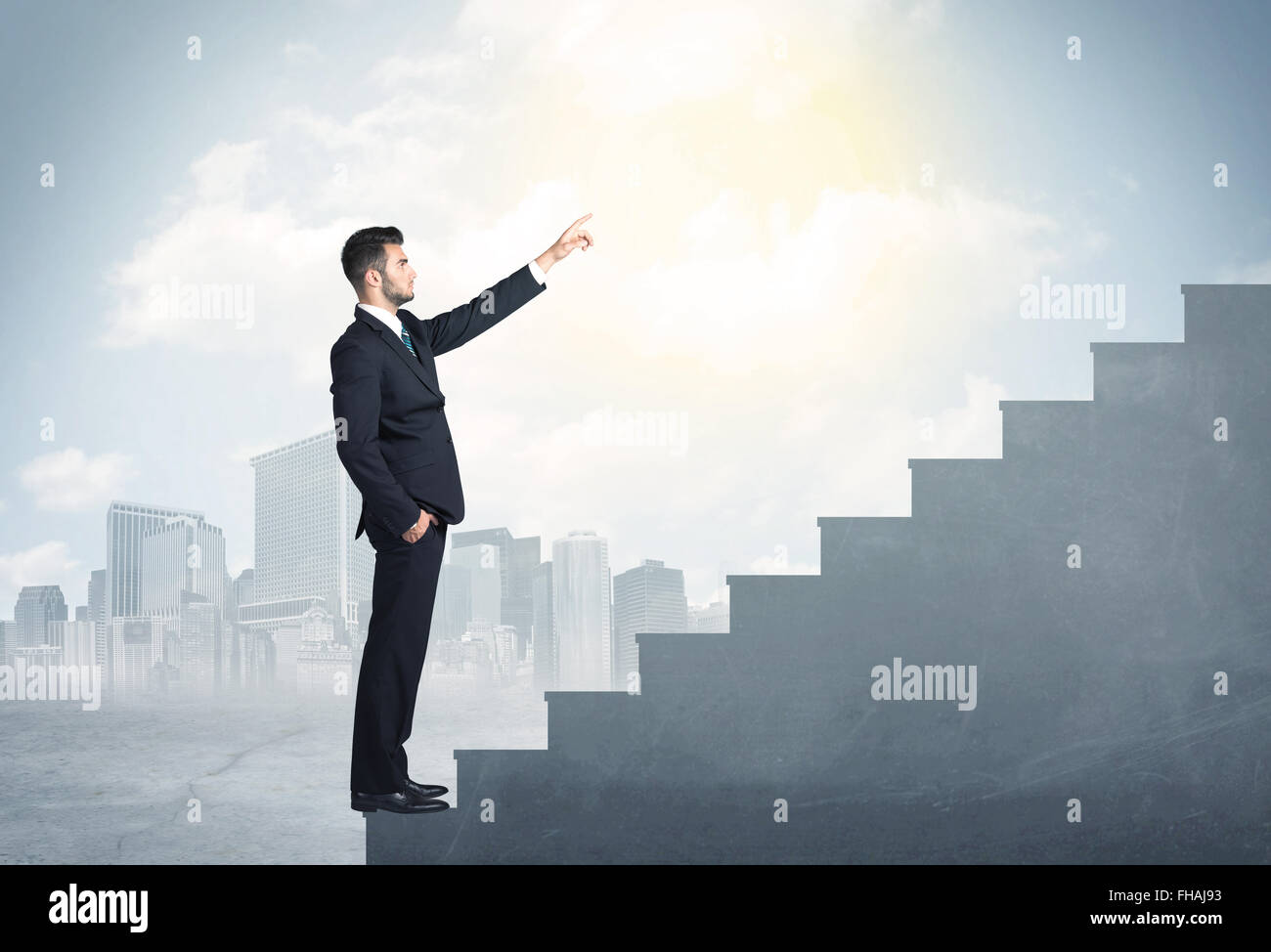 Businessman climbing up a concrete staircase concept Stock Photo - Alamy