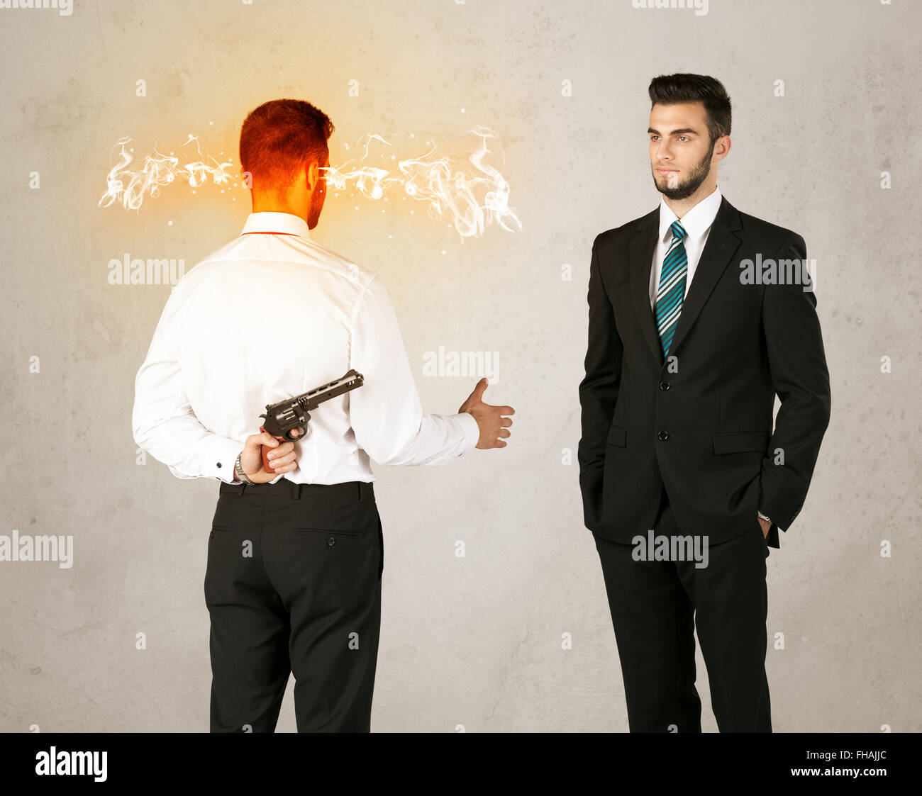 Angry businessman with weapon Stock Photo - Alamy