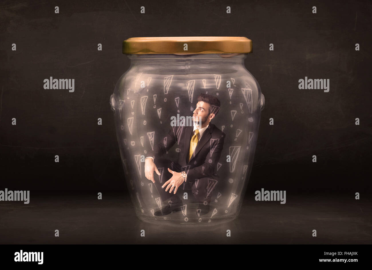 Business man trapped in jar with exclamation marks concept Stock Photo ...