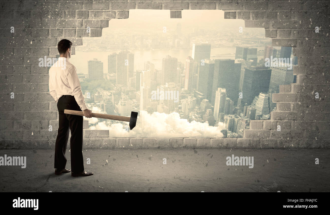 Business man hitting wall with hammer on city view Stock Photo - Alamy