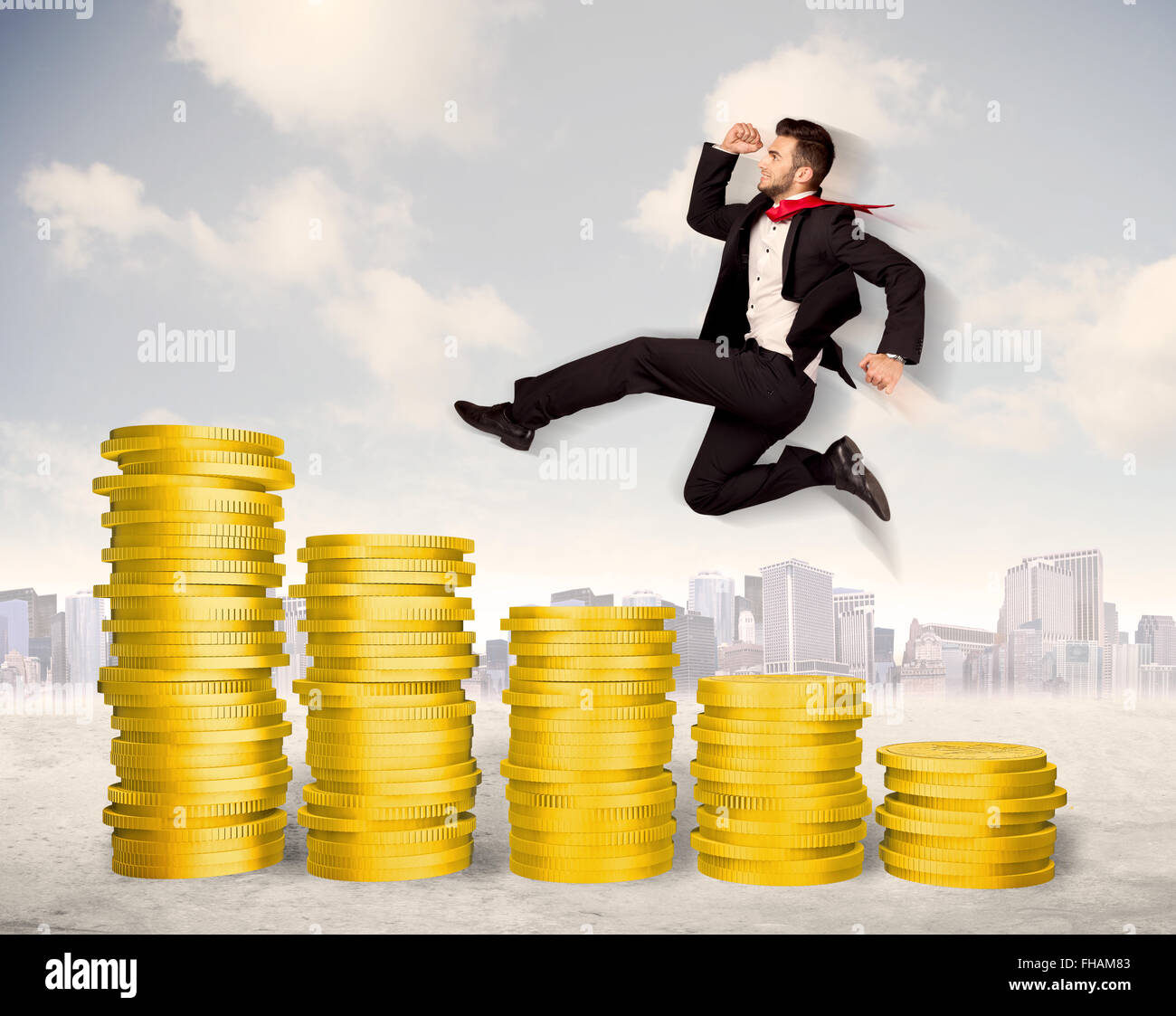 Successful business man jumping up on gold coin money Stock Photo - Alamy