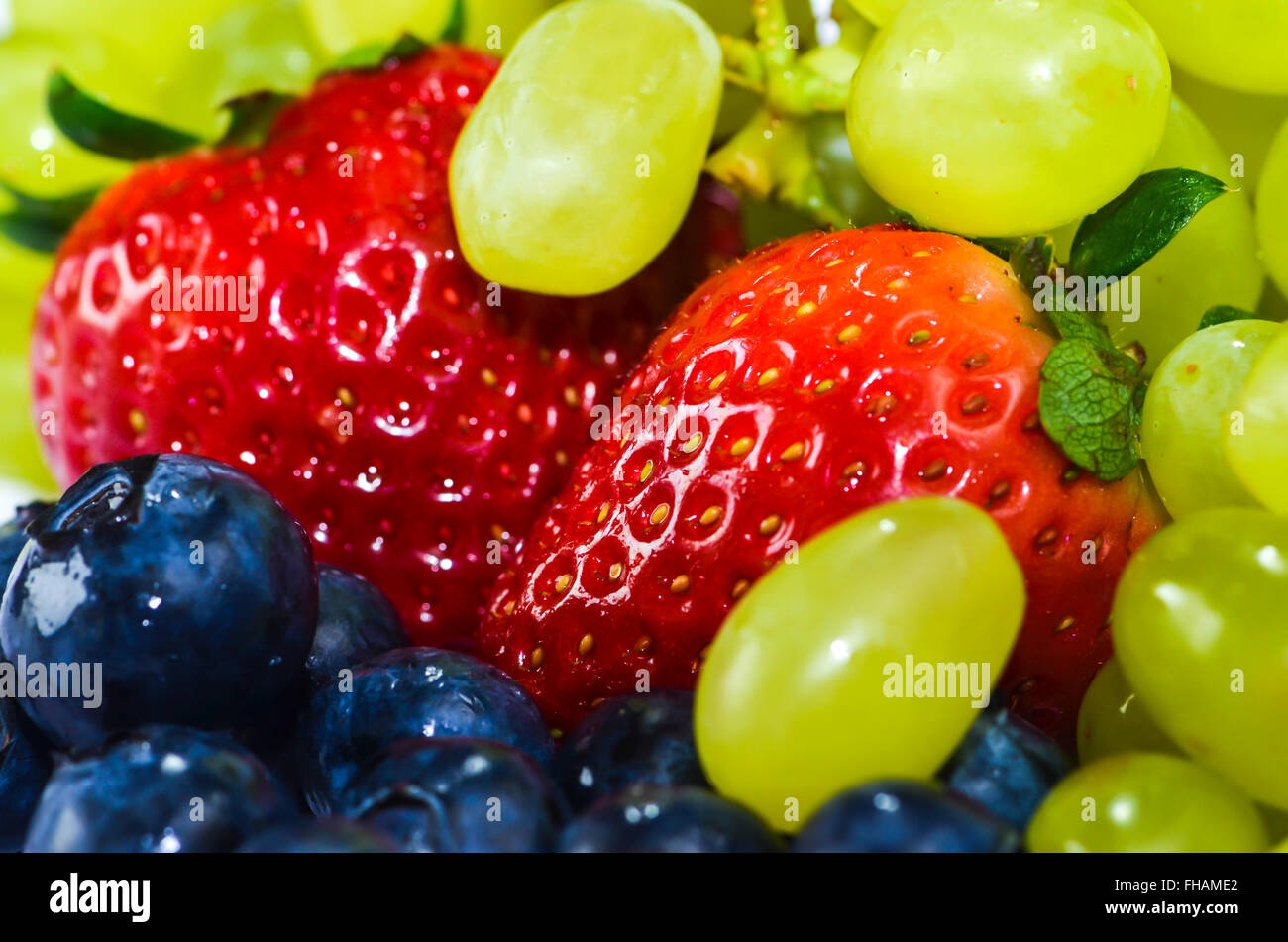 strawberry, grape and bilberries on white background Stock Photo - Alamy