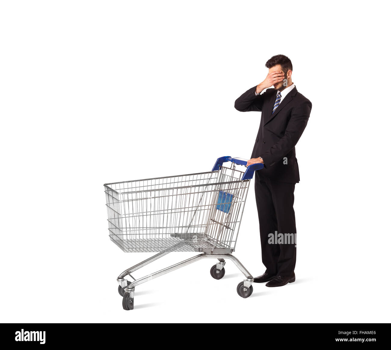 Businessman with shopping cart Stock Photo - Alamy