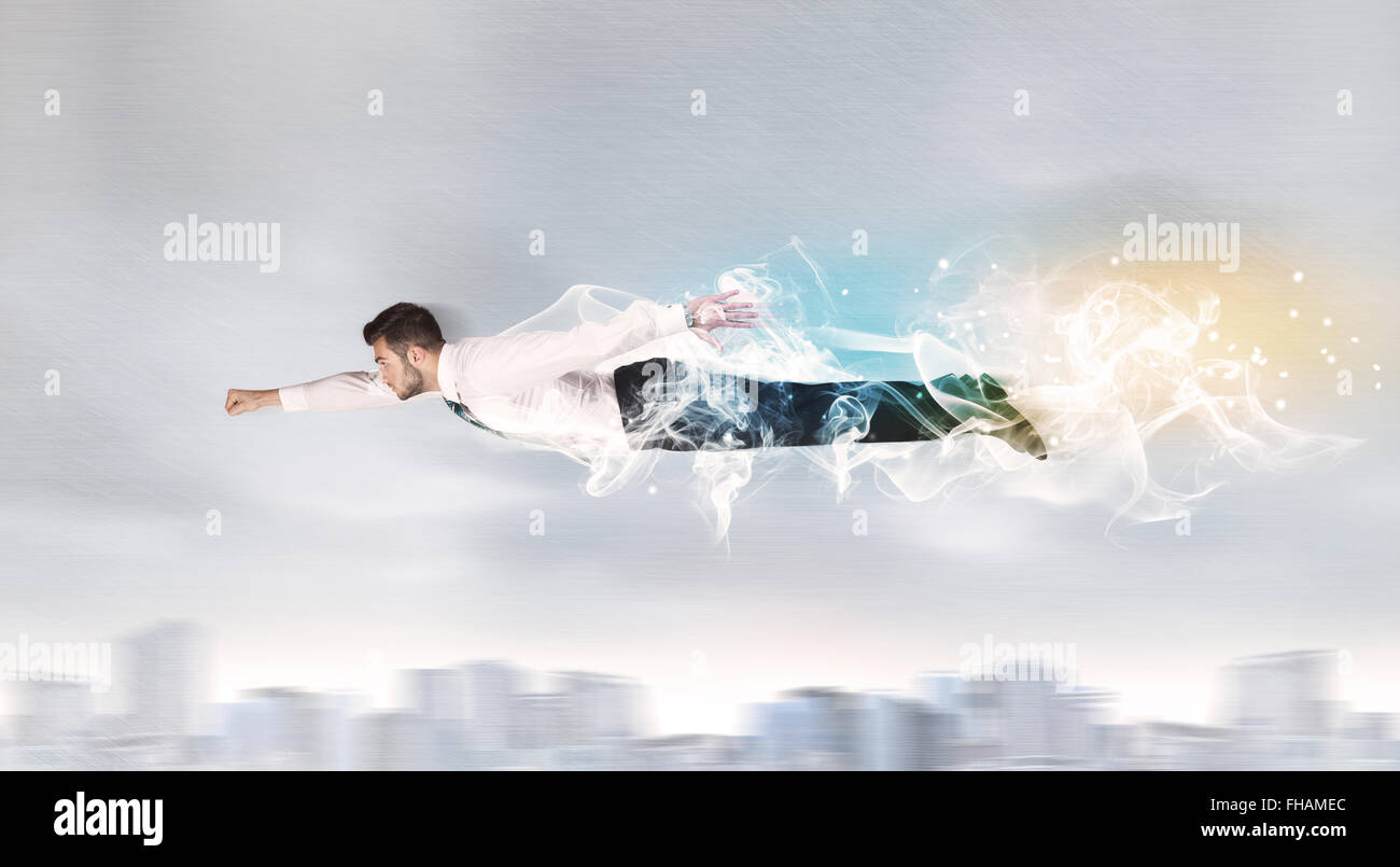Hero superman flying above city with smoke left behind Stock Photo - Alamy