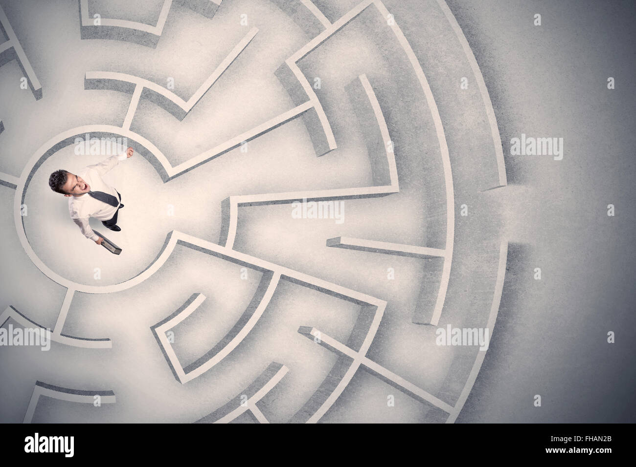 Business man trapped in a circular maze Stock Photo - Alamy