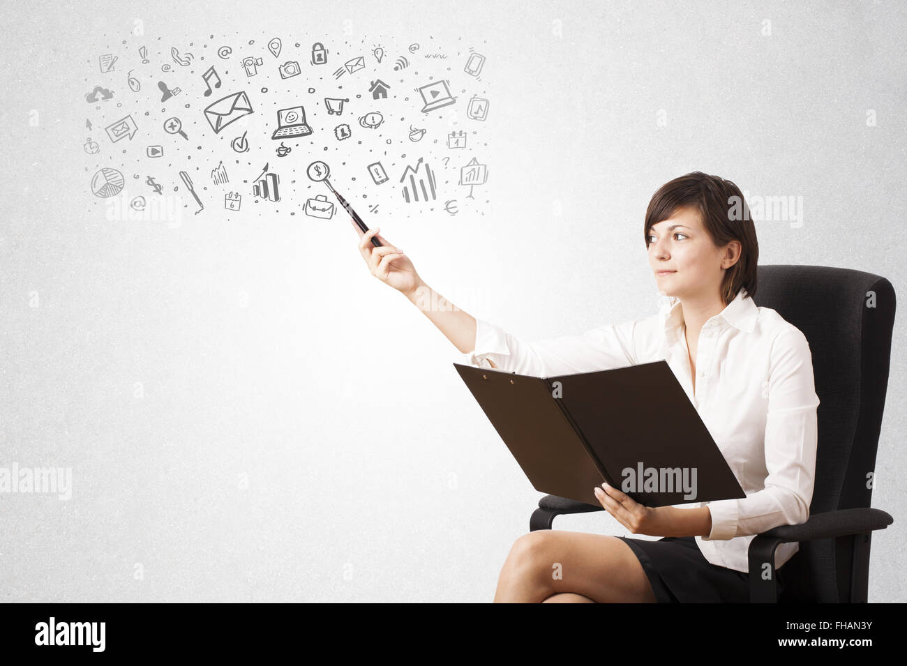 Young woman drawing and sketching icons and symbols Stock Photo - Alamy
