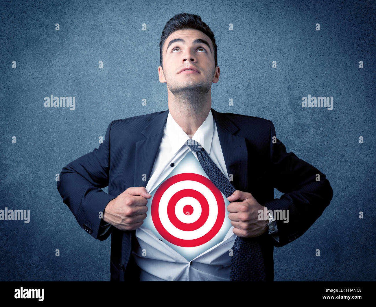 Businessman tearing shirt with target sign on his chest Stock Photo - Alamy