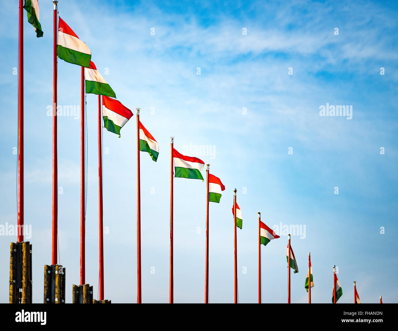 Row of hungarian national flags on Buda castle hill. Budapest city, Hungary, Europe. Blue cloudy ...
