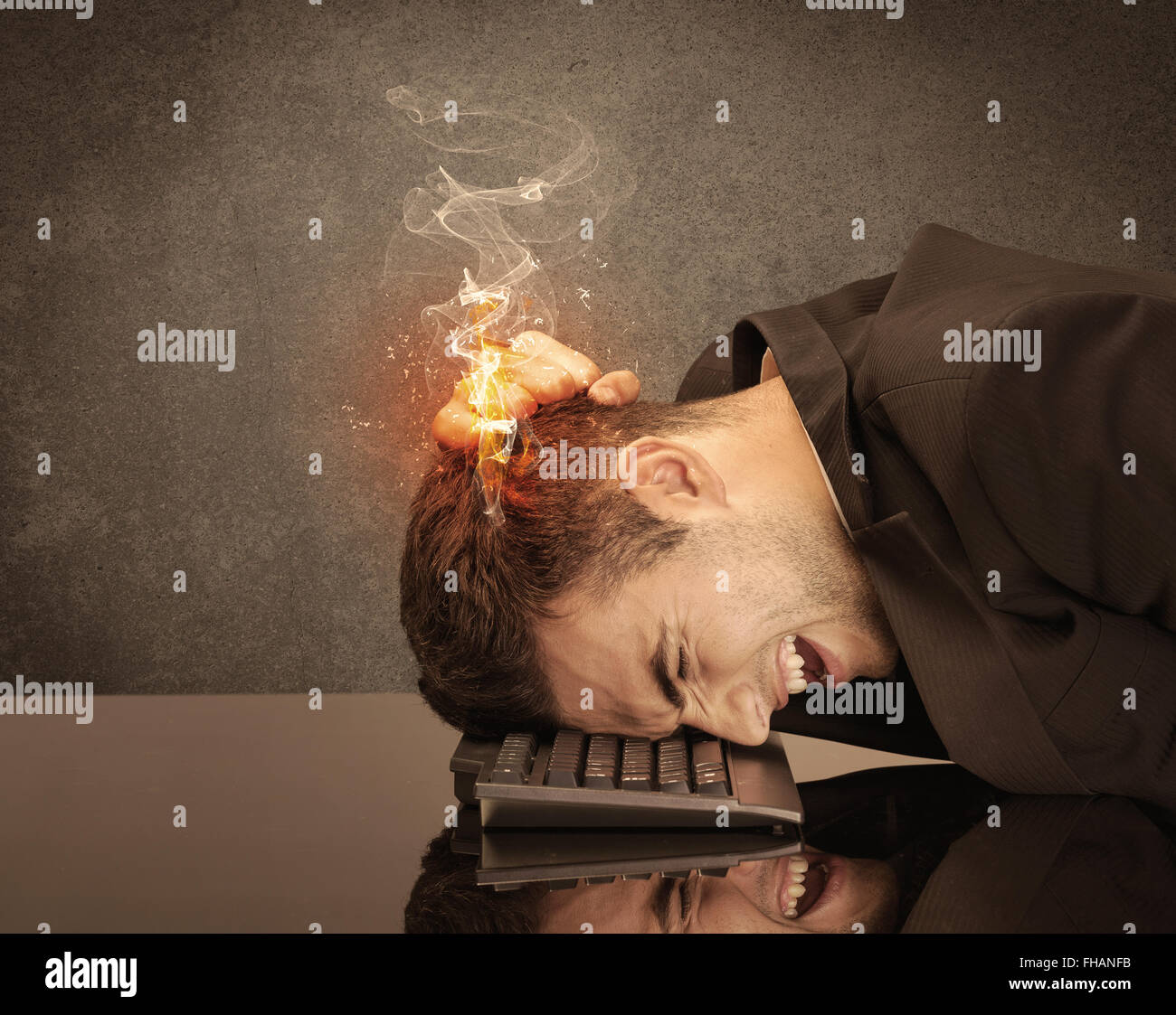 Sad business person's head catching fire Stock Photo - Alamy