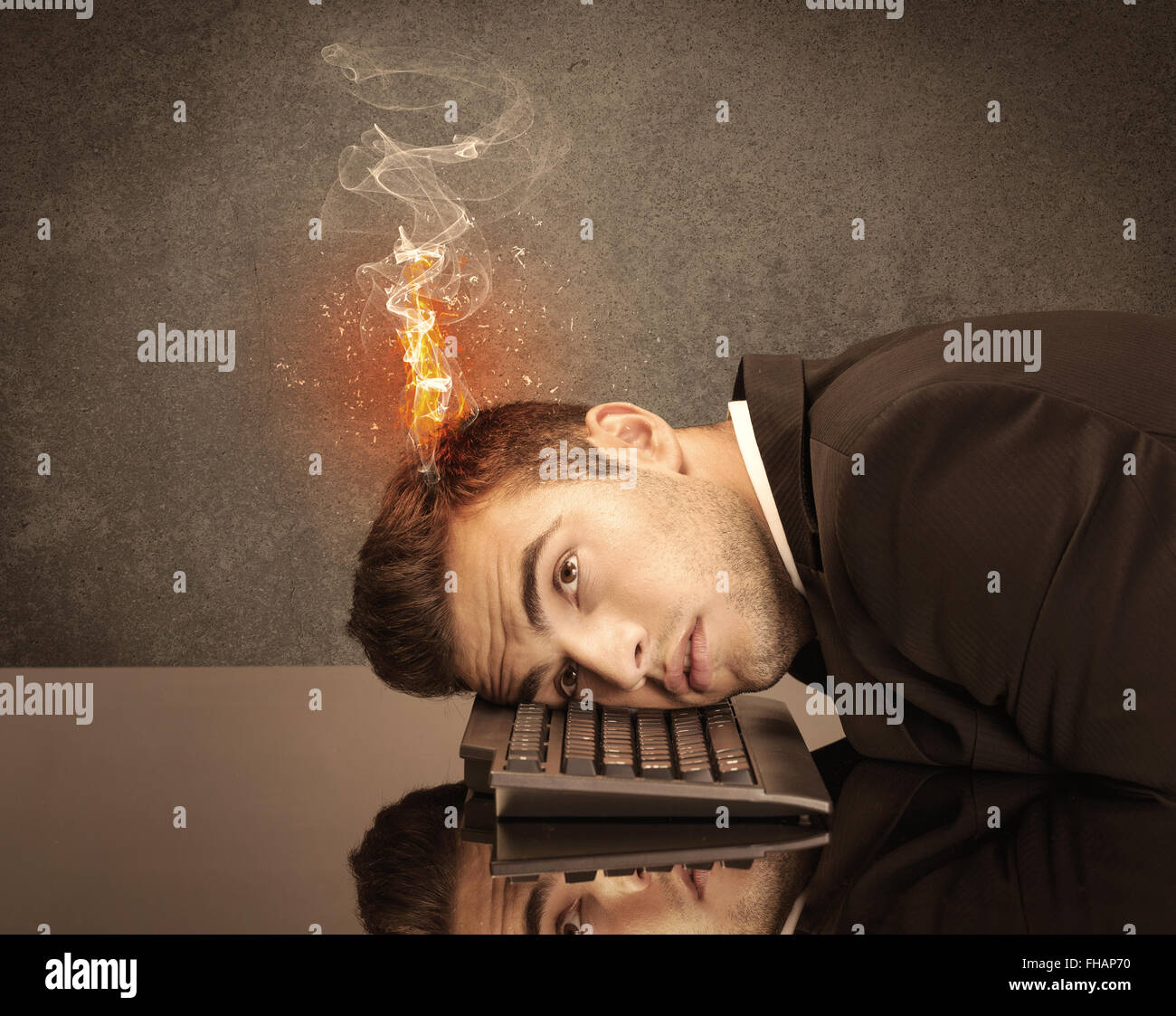 Sad business person's head catching fire Stock Photo - Alamy