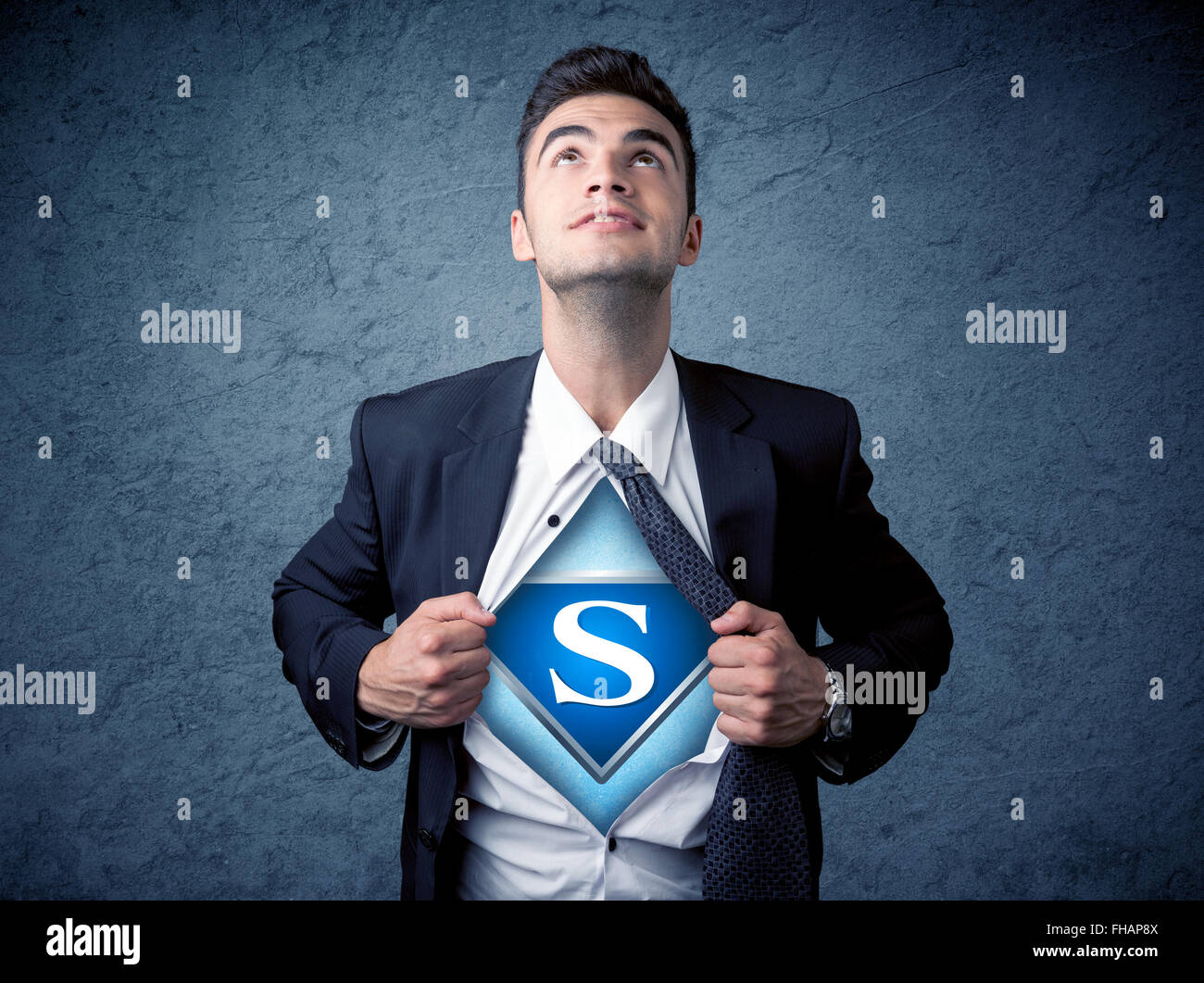 Businessman ripping off his shirt with superhero sign Stock Photo - Alamy