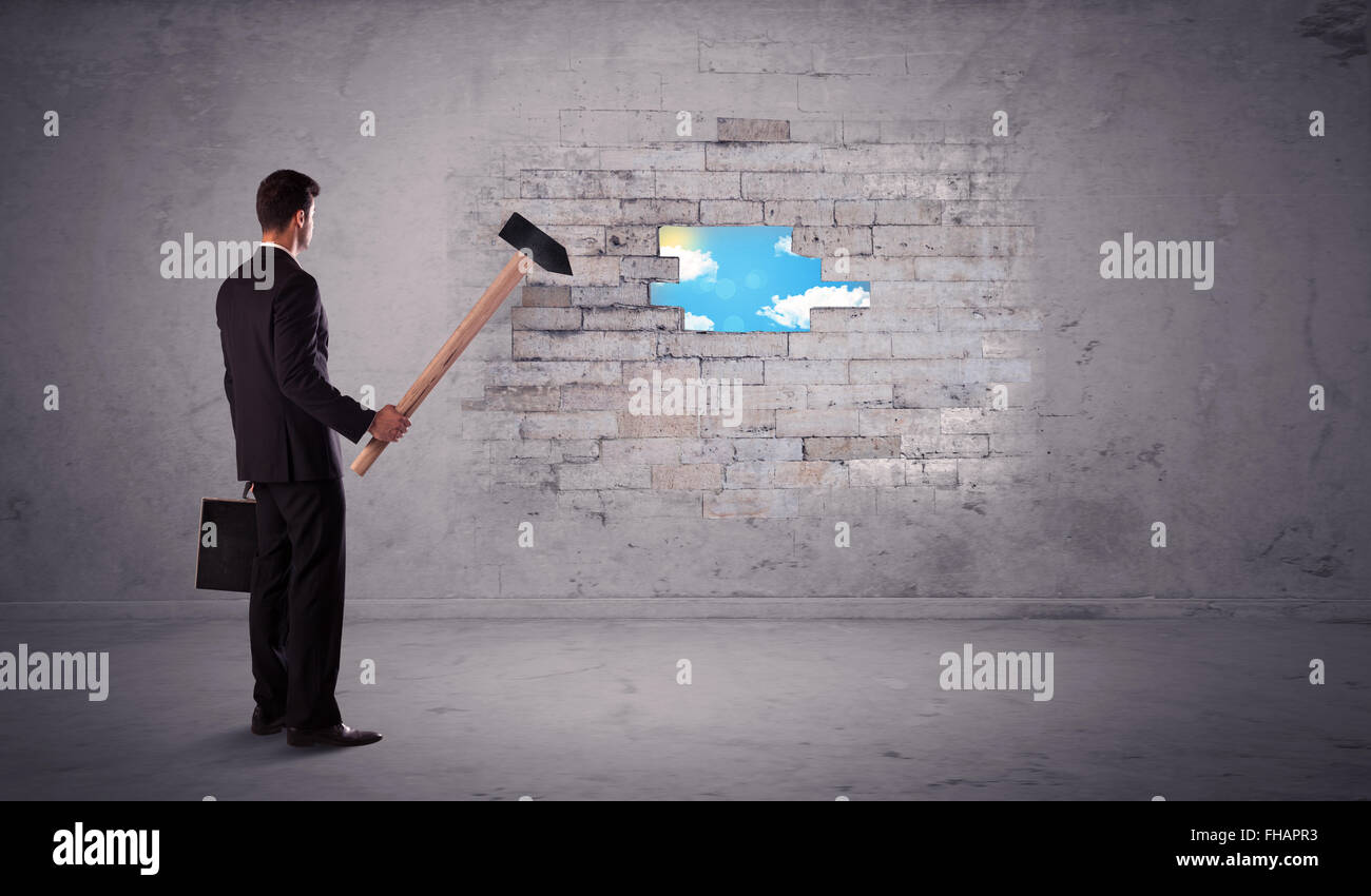 Business man hitting wall hammer hi-res stock photography and images ...