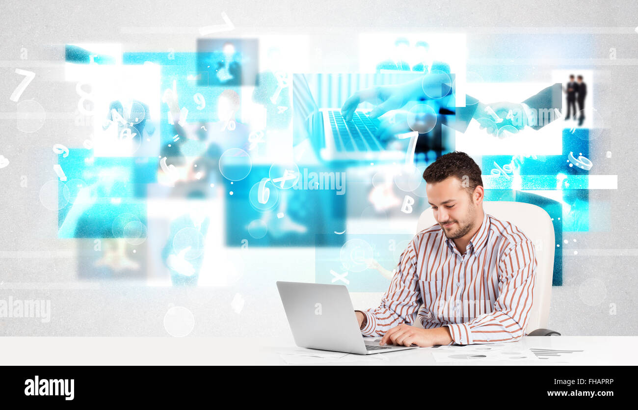 Business person at desk with modern tech images at background Stock ...