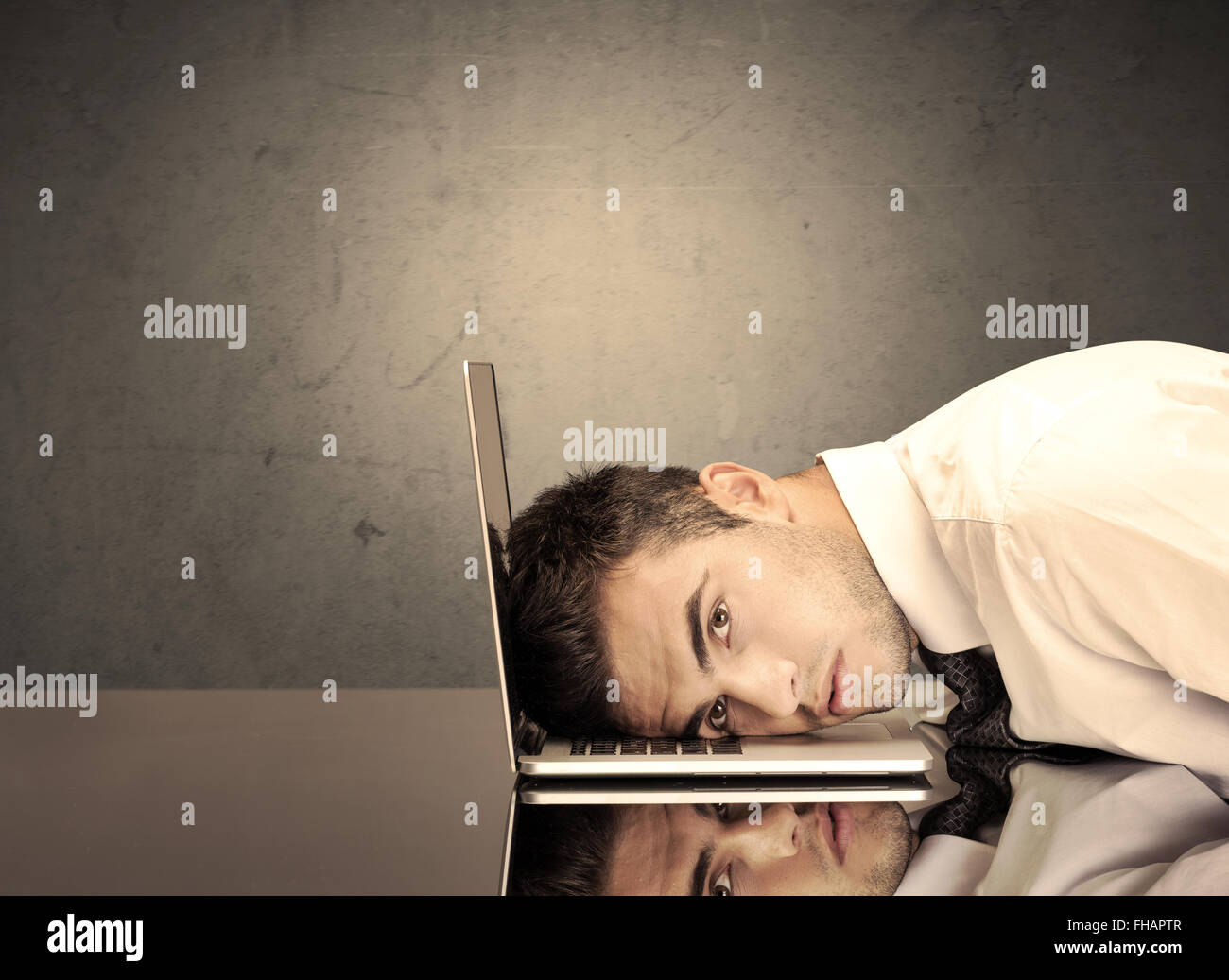 Frustrated businessman's head on keyboard Stock Photo - Alamy