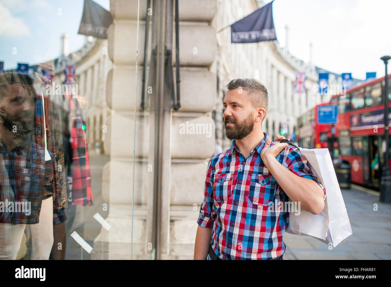 Hipster man shopping in the streets of London Stock Photo - Alamy
