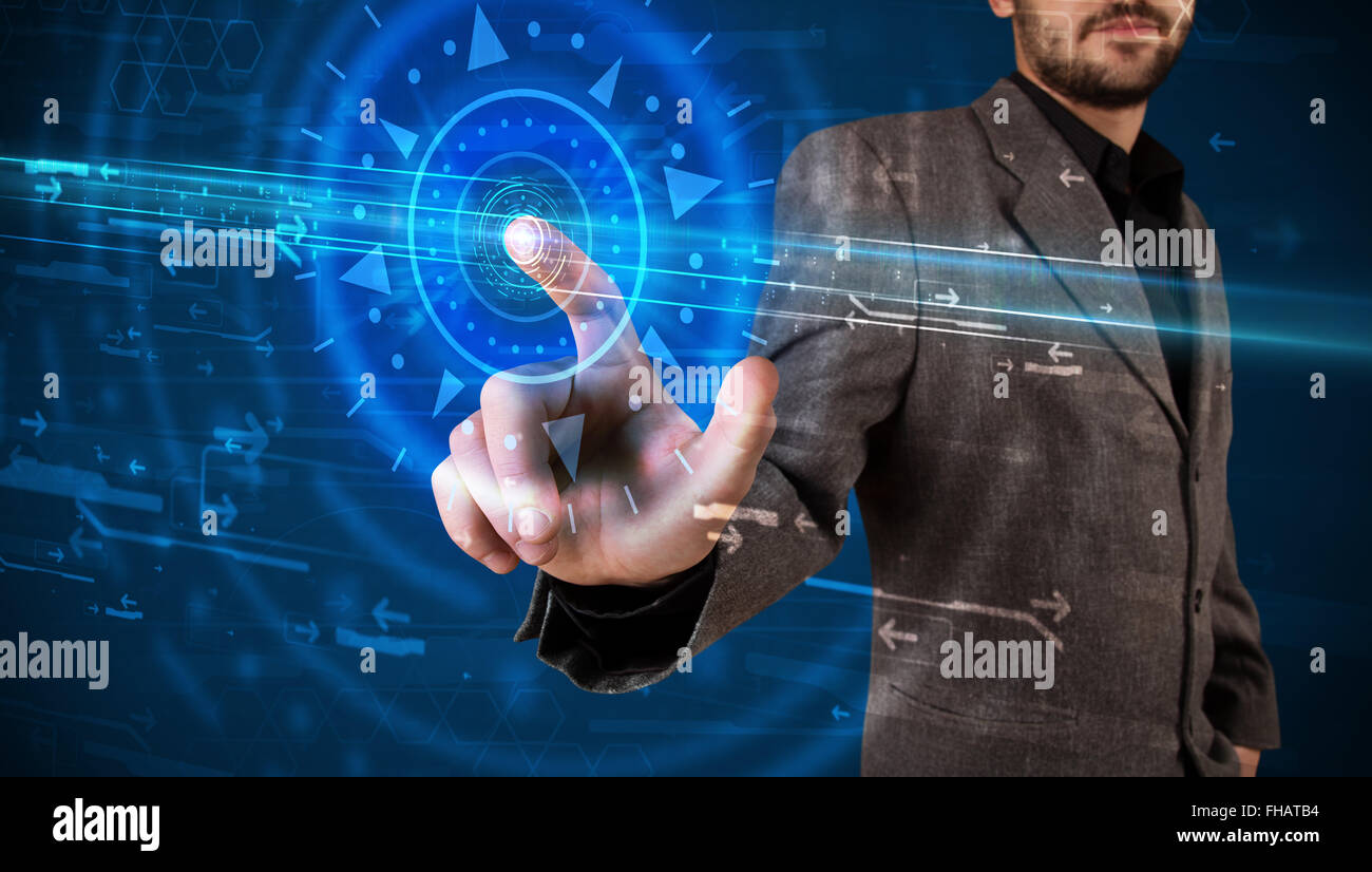 Handsome tech guy pressing high technology control panel screen concept ...