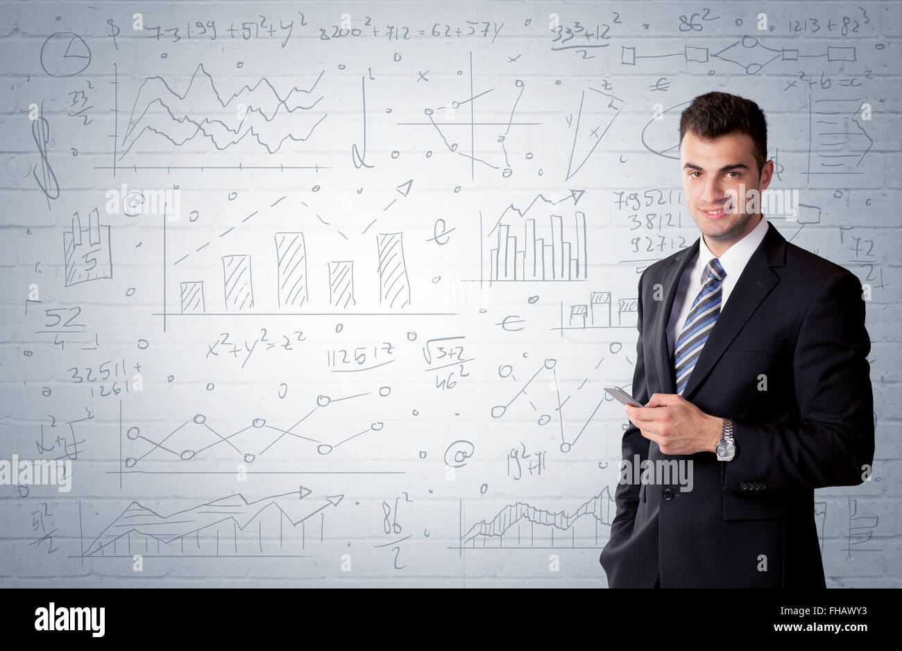 Salesman standing with drawn graph charts Stock Photo - Alamy