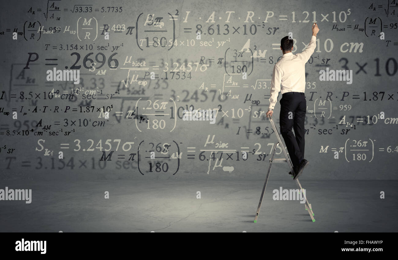 Man calculating from ladder Stock Photo - Alamy
