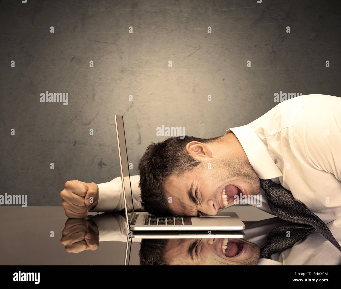 Frustrated businessman's head on keyboard Stock Photo - Alamy