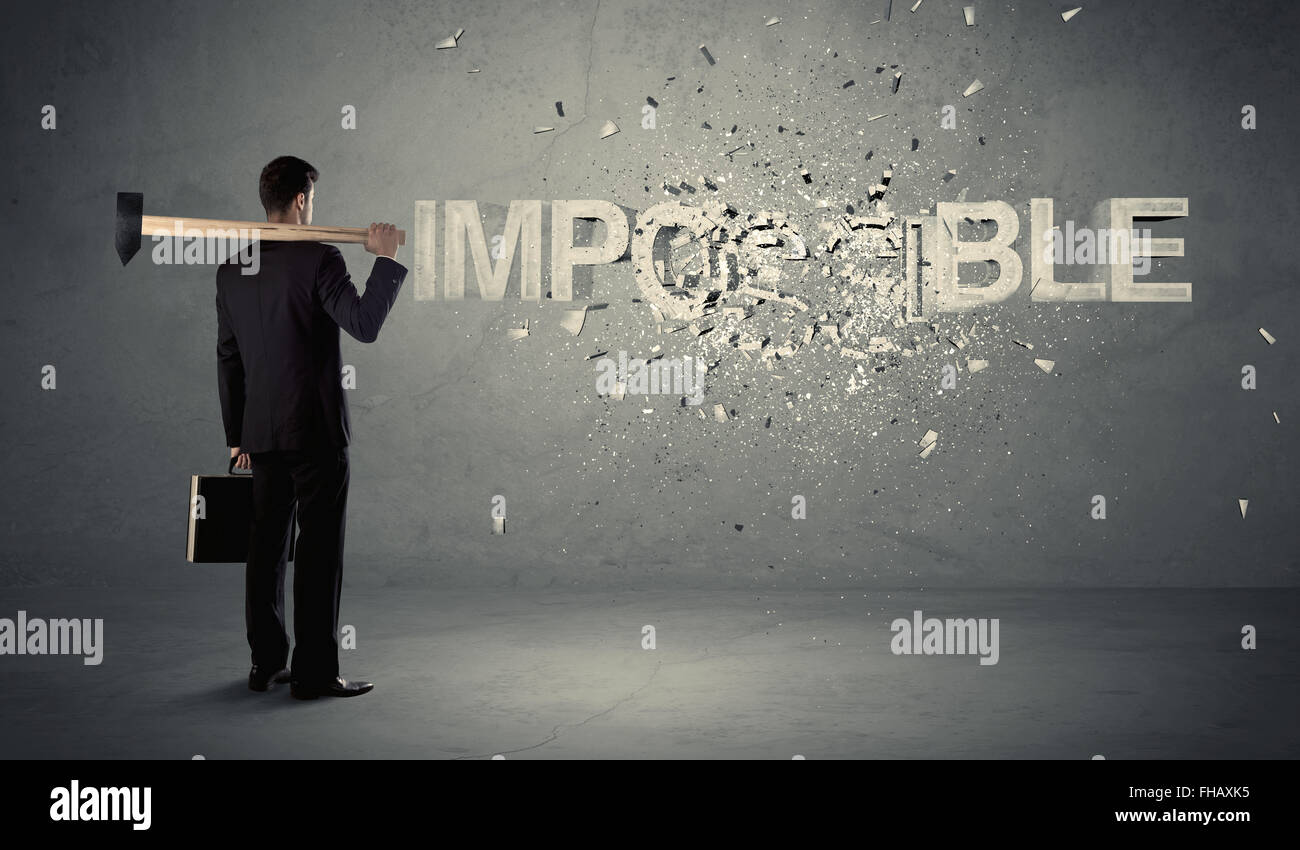 Business man hitting impossible sign with hammer Stock Photo - Alamy