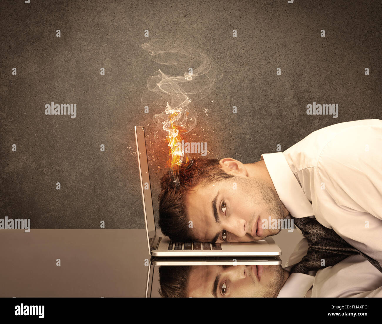Sad business person's head catching fire Stock Photo - Alamy