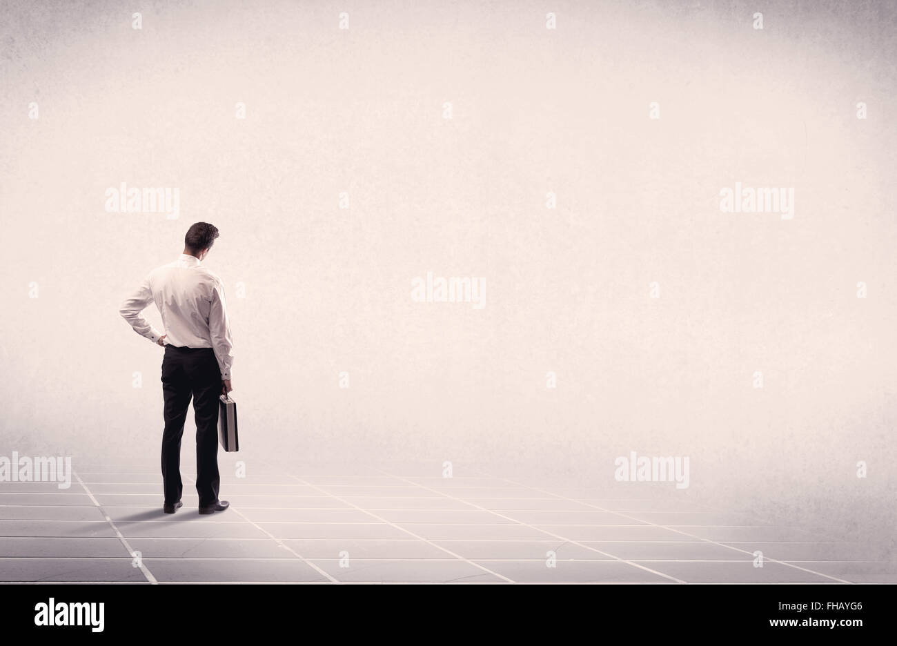Business person standing in empty space Stock Photo - Alamy